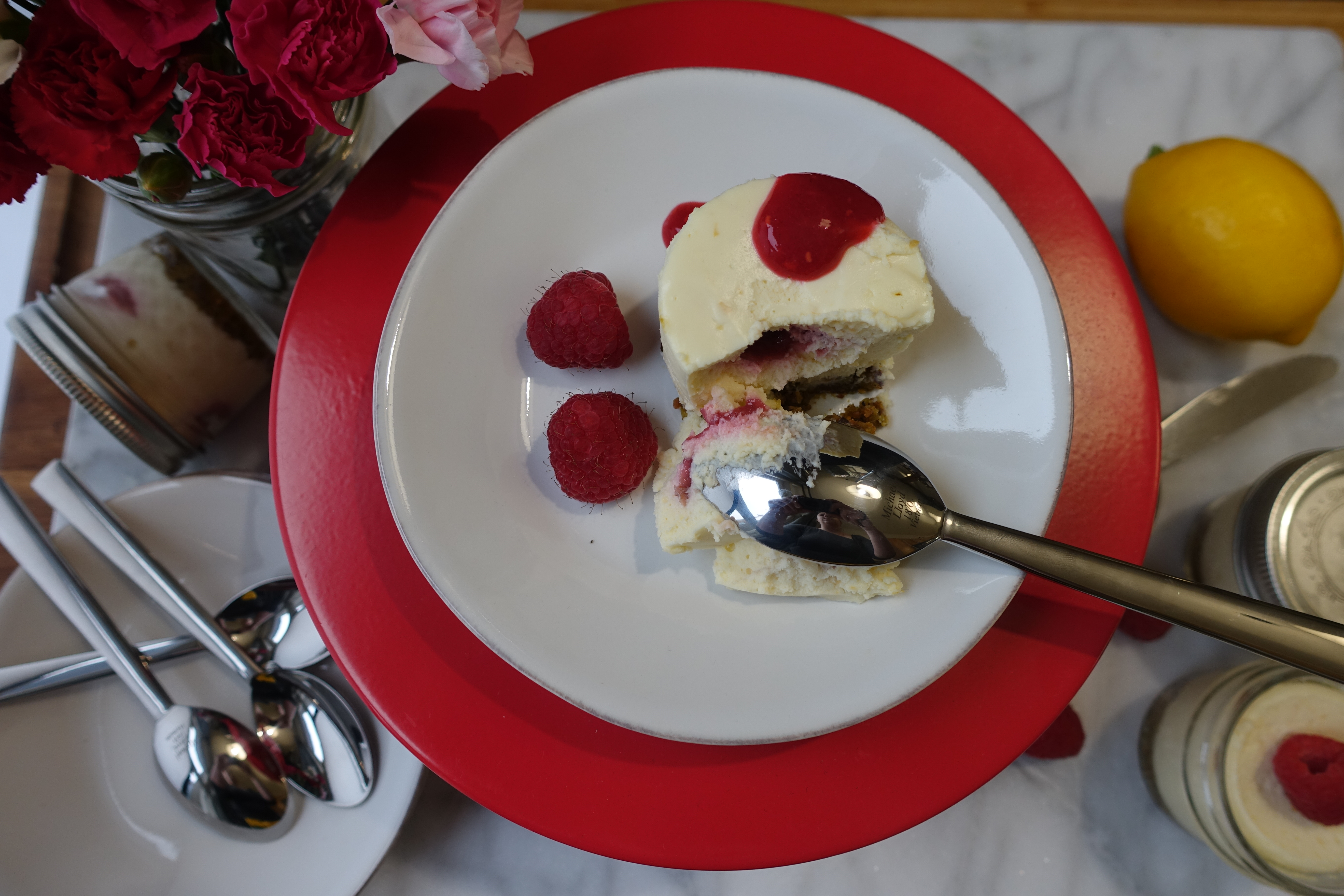 Sous Vide Meyer Lemon Cheesecake with Pistachio Crust & Raspberry Coulis